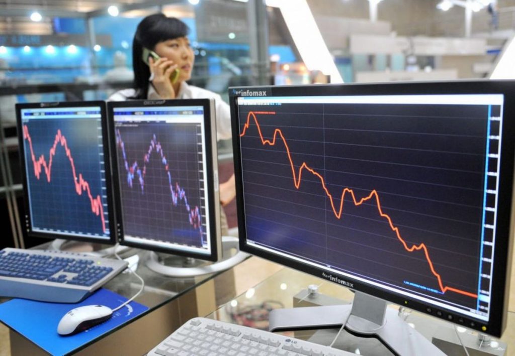 What is a company delisting and when it occurs